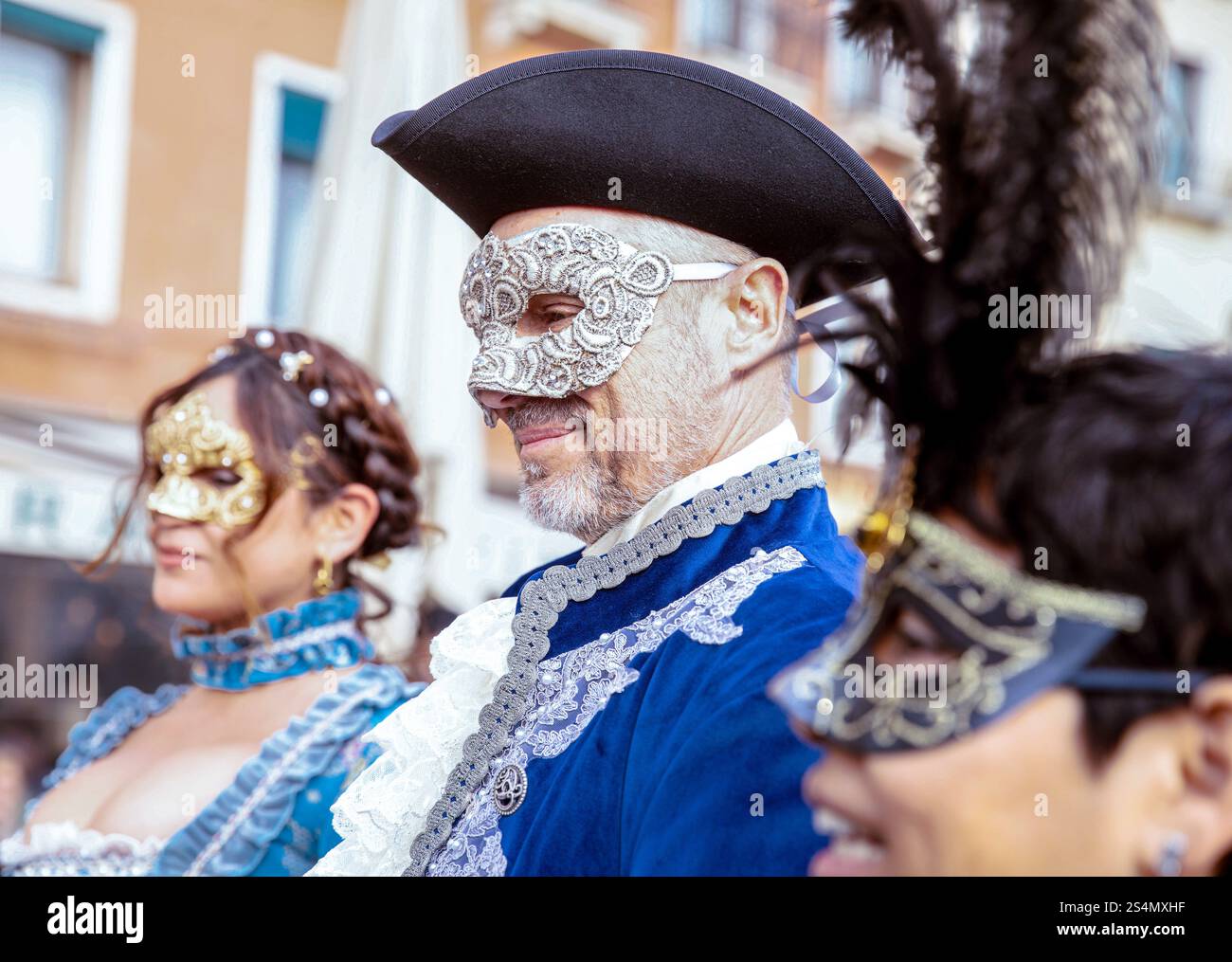 Caucasian adults in ornate masks and costumes at a venetian fest Stock ...