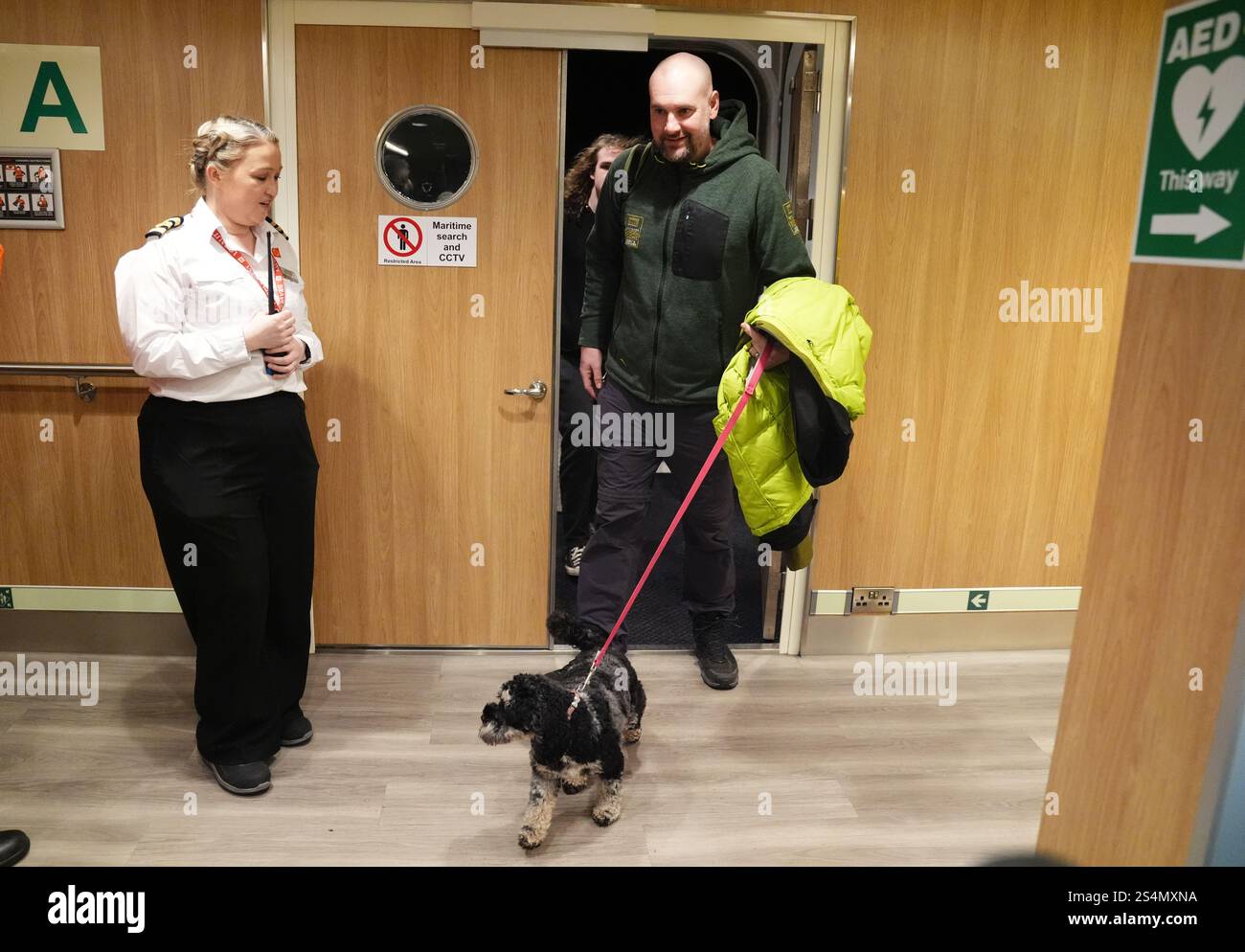 Passengers as they go onboard The Glen Sannox ferry as it journeys from ...