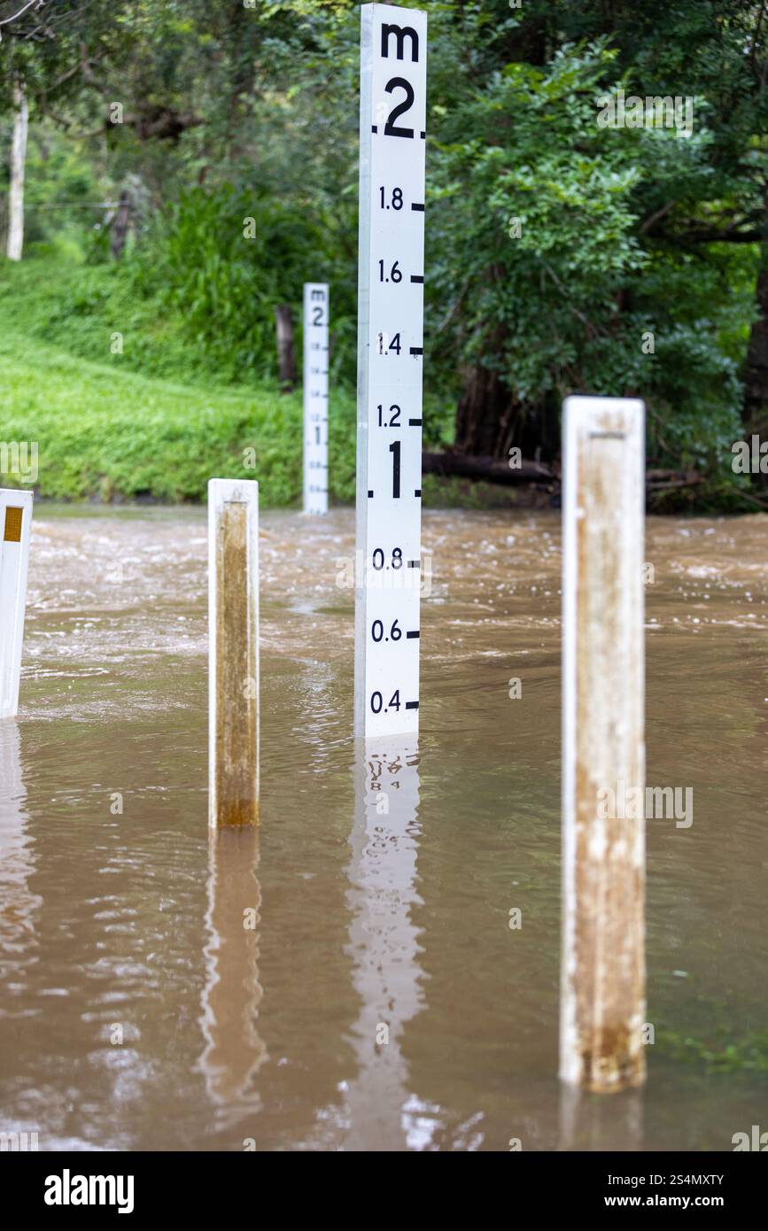 Flood Gauge Sign in Rising Waters over Road in Brookfield Brisbane ...