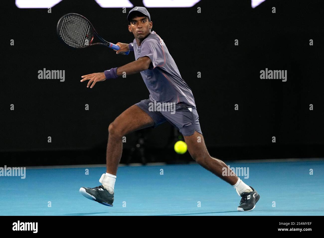 Nishesh Basavareddy of the U.S. plays a forehand return to Novak ...