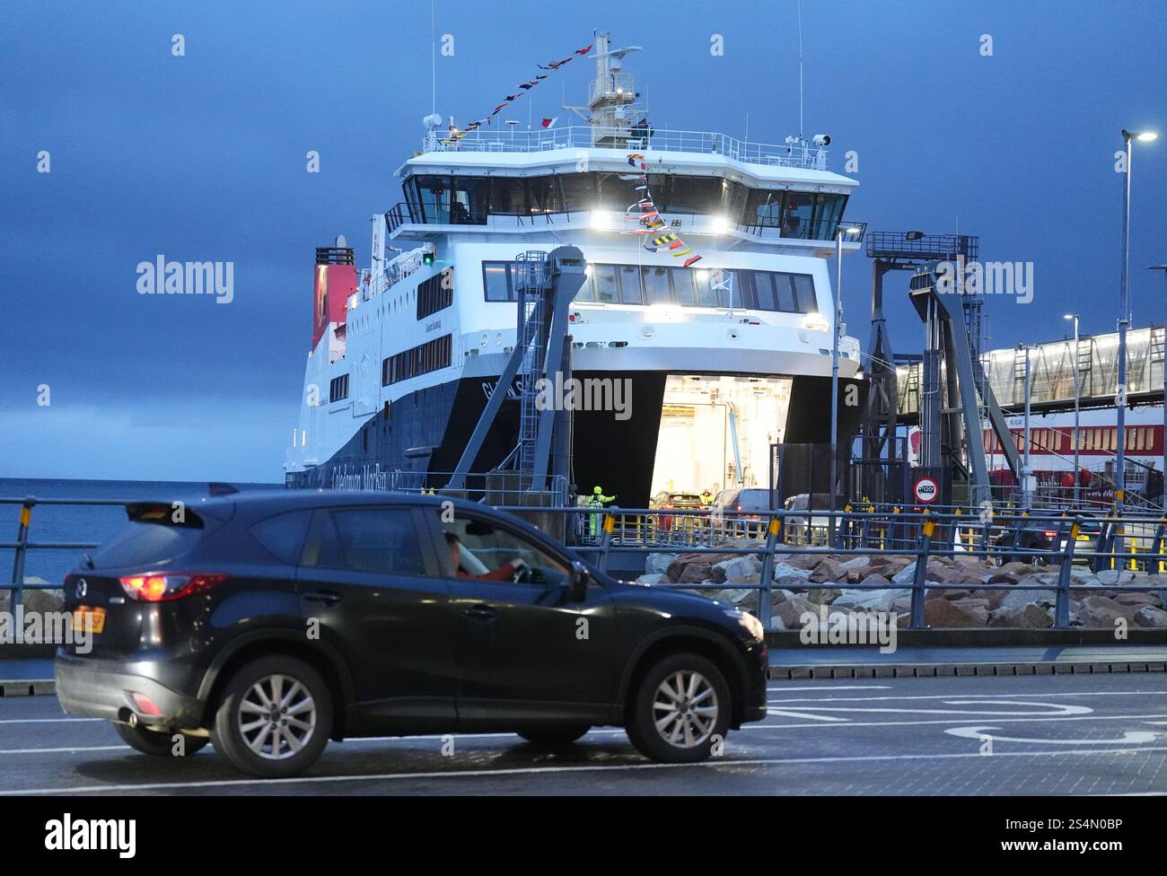 Vehicles go onboard The Glen Sannox ferry as it journeys between Troon ...