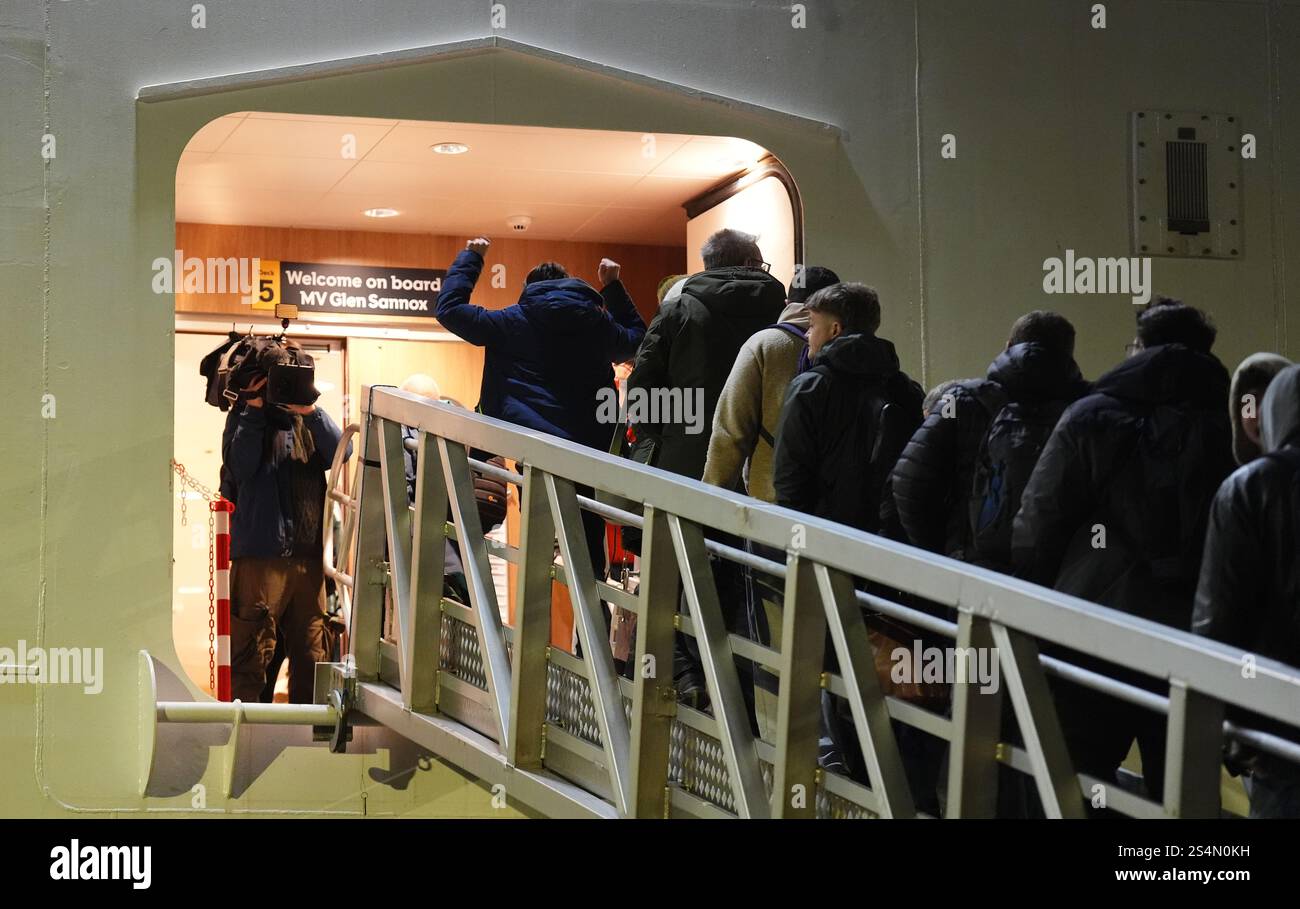 Passengers as they go onboard The Glen Sannox ferry as it journeys from ...
