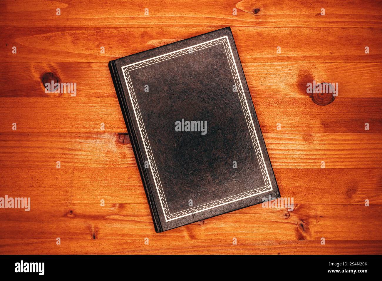 Top view of old vintage hardcover book front cover as mockup copy space ...