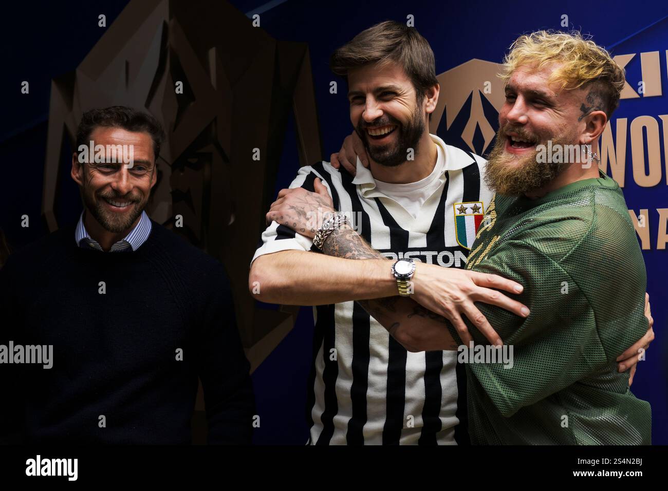 Turin, Italy. 12 January 2025. Gerard Pique hugs Jake Paul next to ...