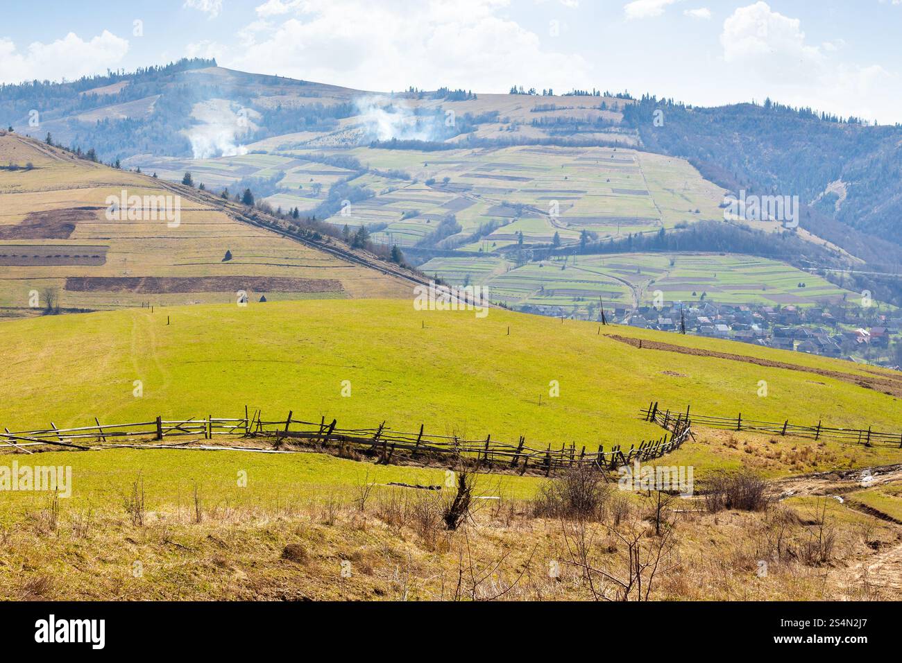 carpathian countryside scenery with fields on the hills and village in ...