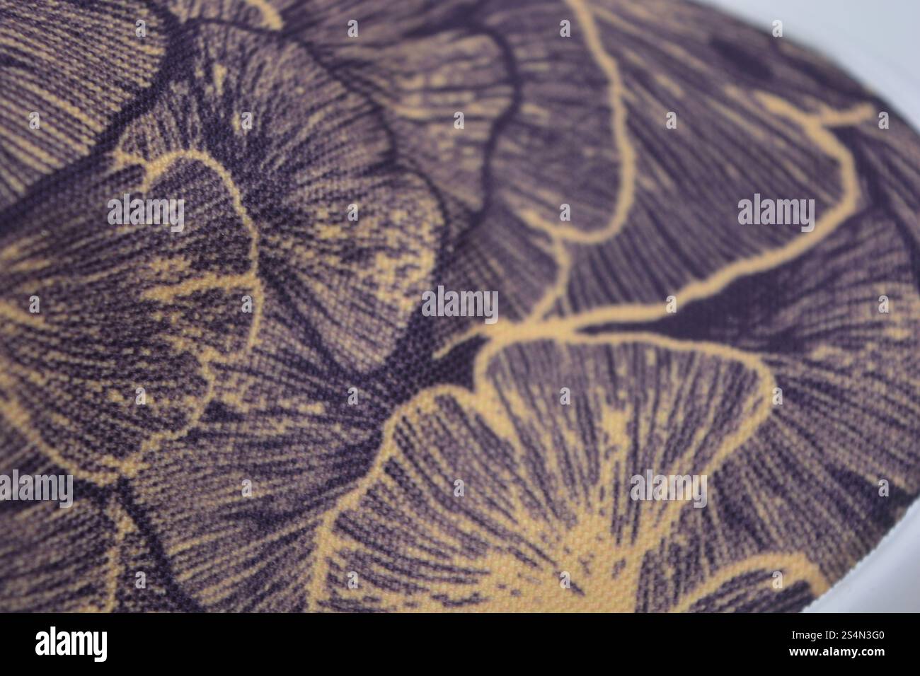 Unusual fabrics, denim with an unusual pattern of orange flowers on a ...