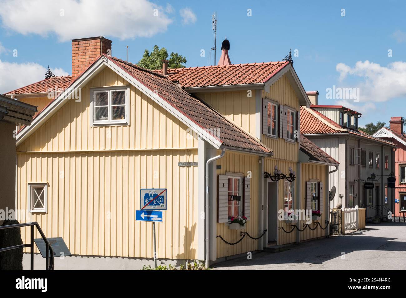 Narrow pedestrian street with wooden buildings. Stora Gatan, Sigtuna ...