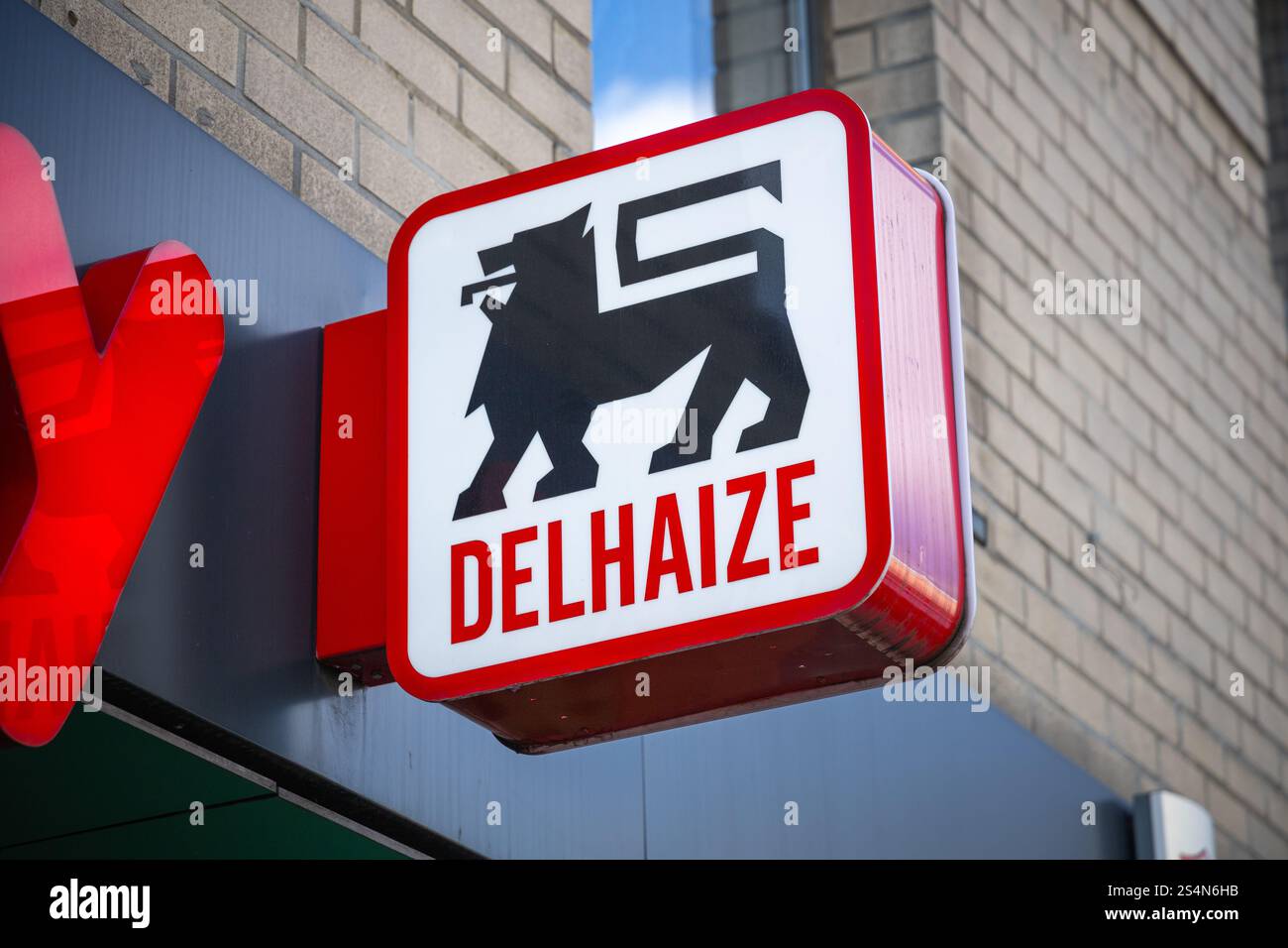 Antwerp, Belgium. 15 April 2023. Delhaize shop logo sign above the ...