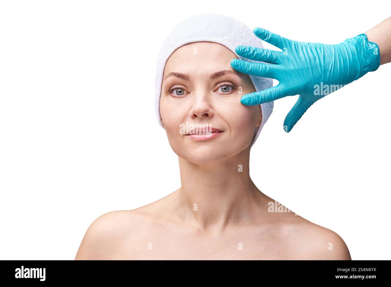 Dermatological examination of caucasian woman's face by medical ...