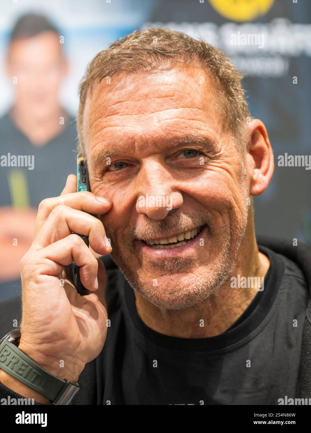 13 January 2025, Bavaria, Munich: Actor Ralf Moeller talks on his cell ...