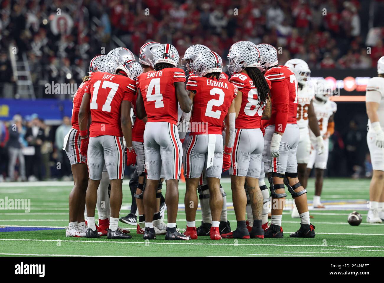 ARLINGTON, TX - JANUARY 10: Ohio State Buckeyes players huddle up ...
