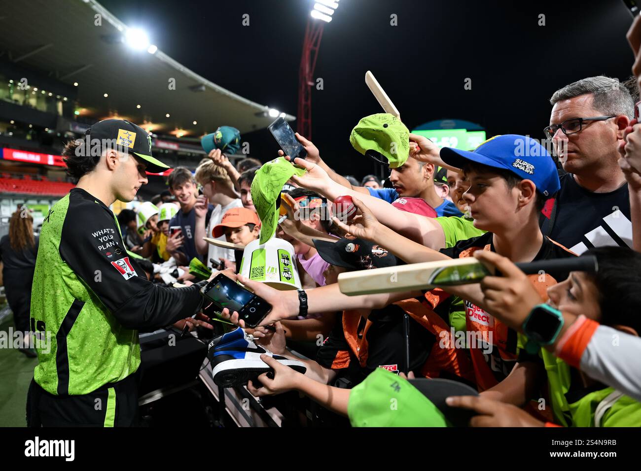Sam Konstas of the Thunder signs autographs after the Big Bash League ...
