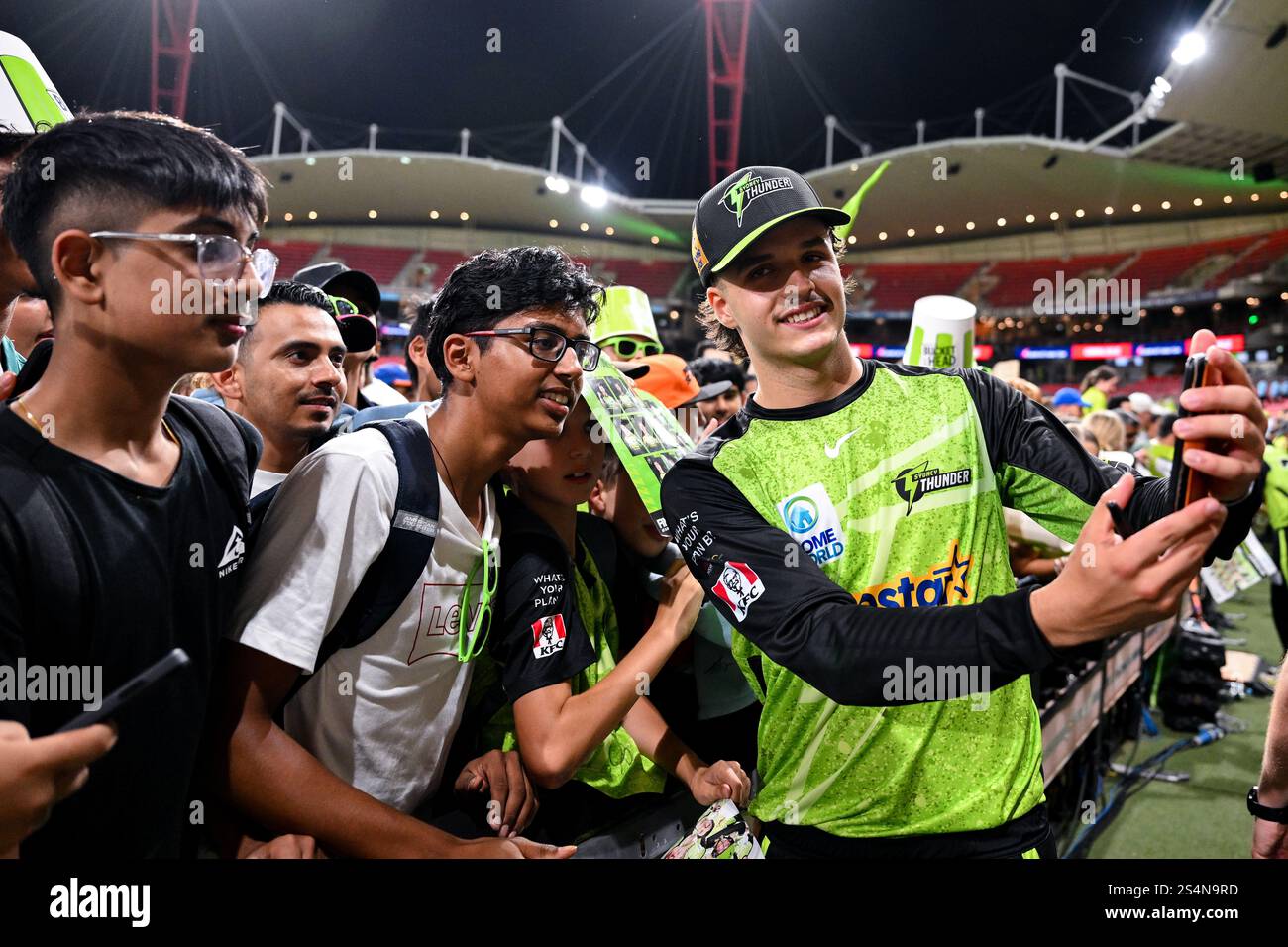 Sydney, Australia. 13th Jan, 2025. Sam Konstas of the Thunder signs ...