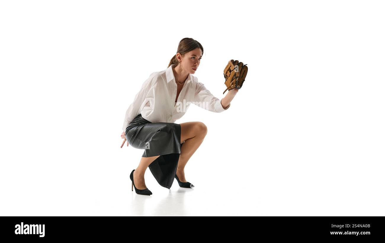 Woman crouched holding baseball glove, embodying strategic preparation ...