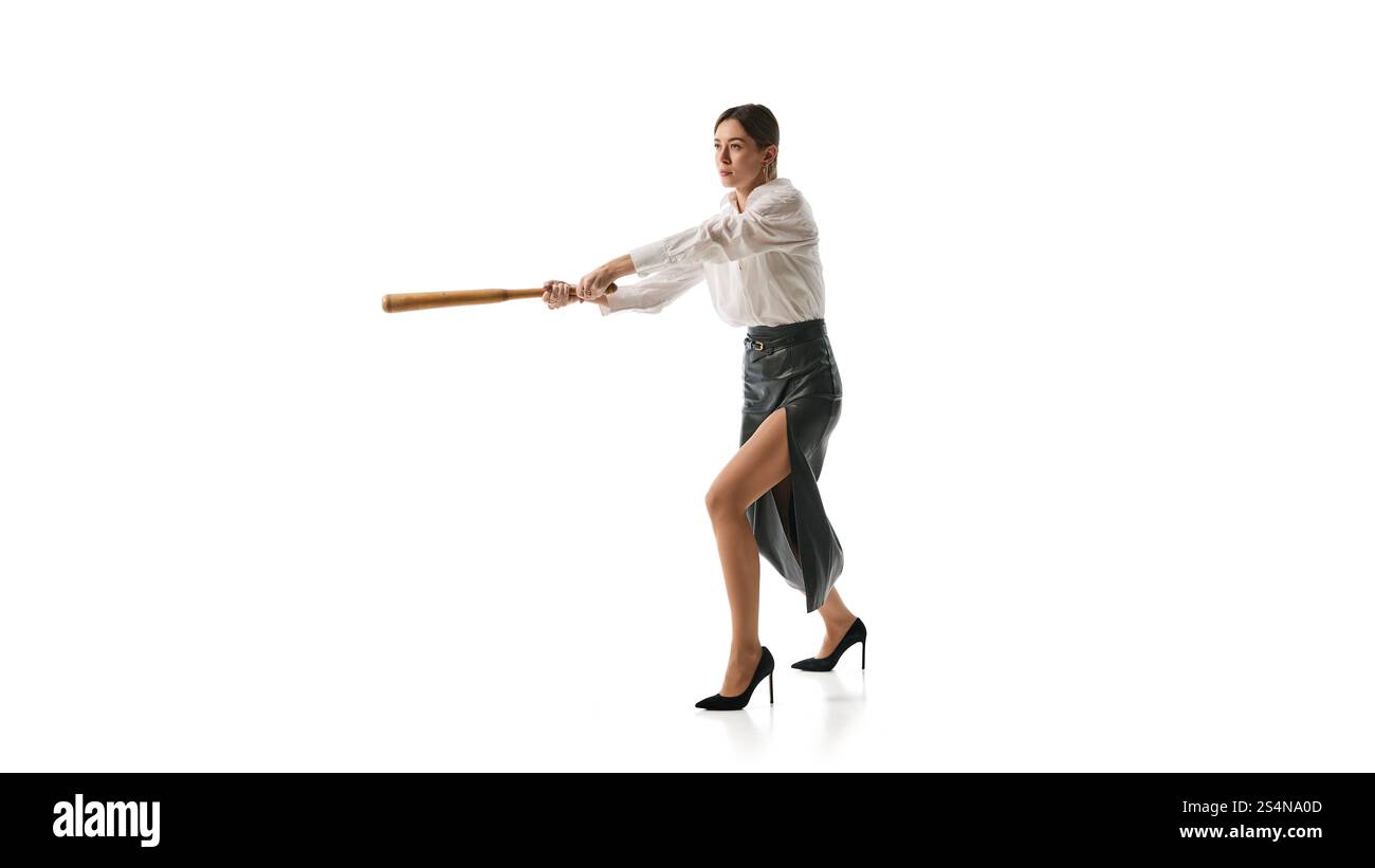 Woman in professional outfit swinging baseball bat, symbolizing ...