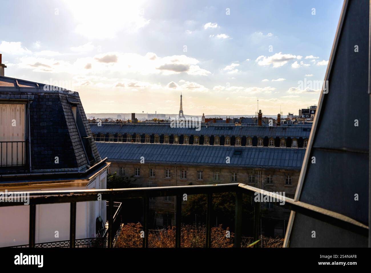 Open window with romantic view of rooftops and Eiffel Tower in Paris ...