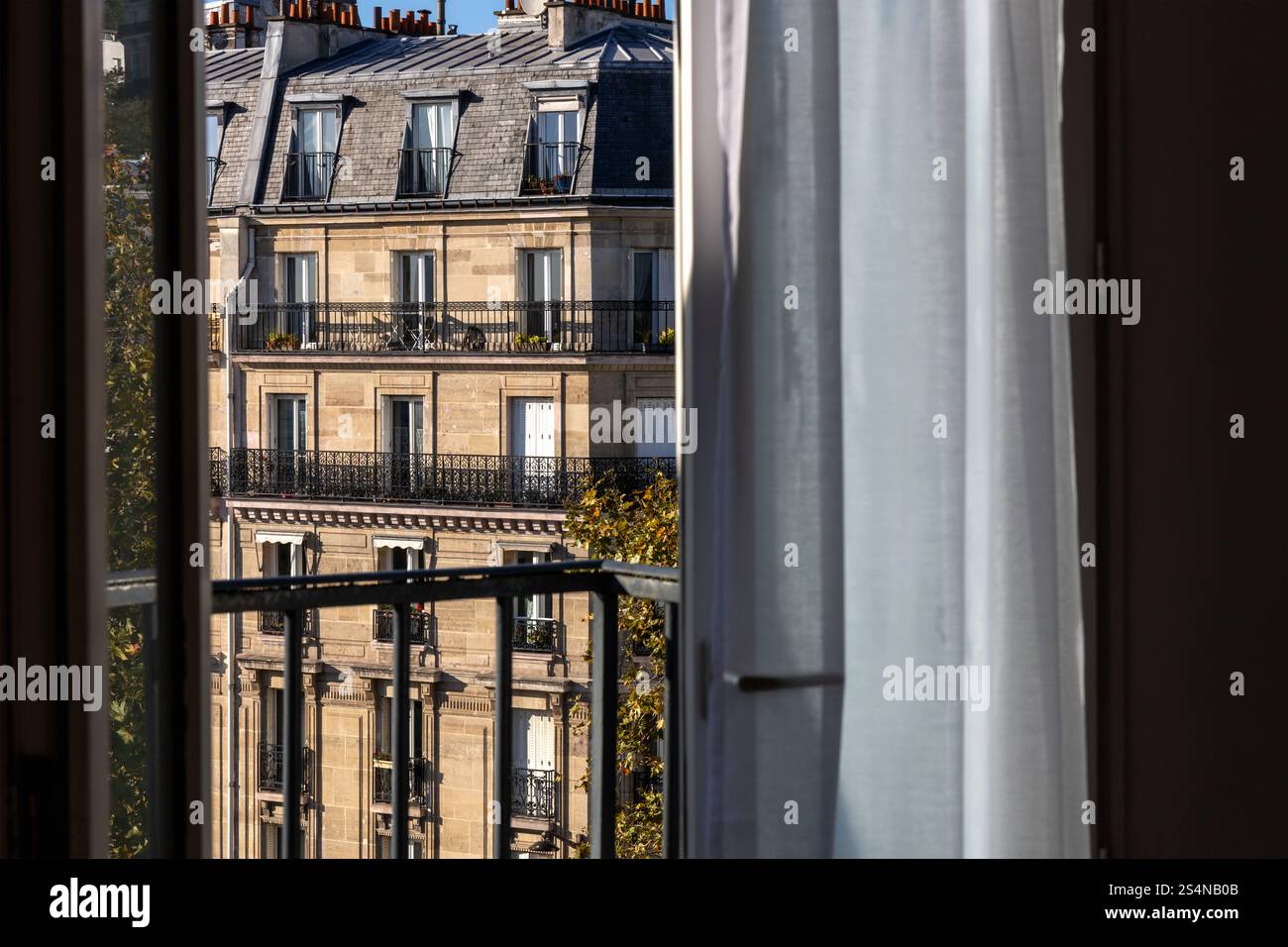 Open window overlooking the city with old buildings. Paris, France ...
