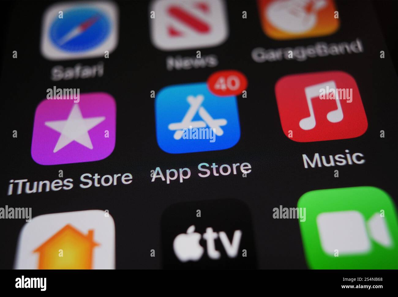 Icons for the Apple App Store, iTunes Store, and Apple Music displayed on the screen of an ...