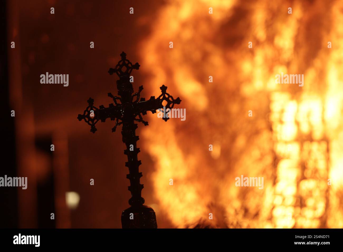 Cross silhouetted against fiery sky hi-res stock photography and images ...