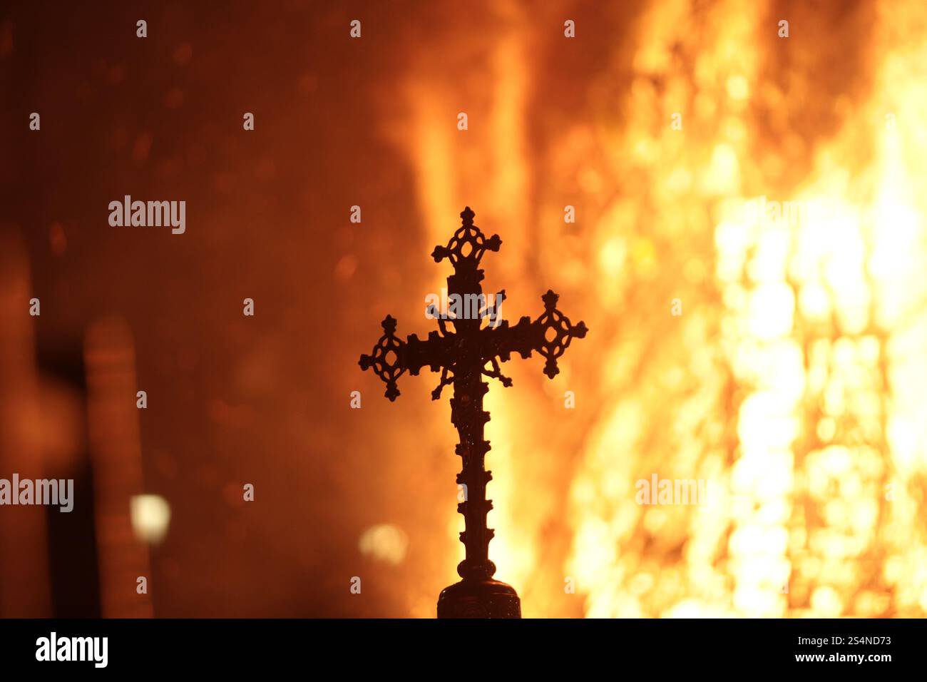 Cross silhouetted against fiery sky hi-res stock photography and images ...