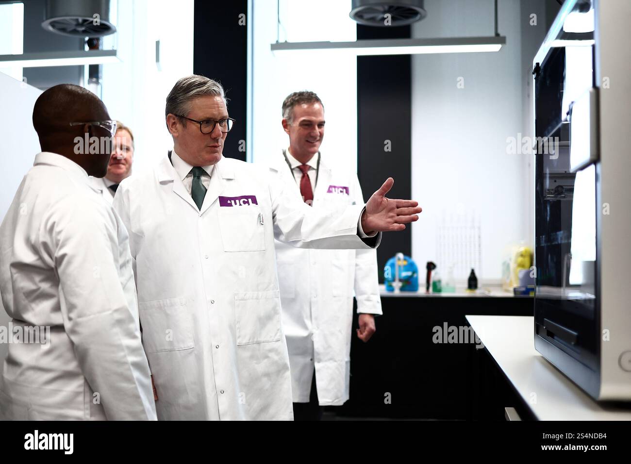 Prime Minister Sir Keir Starmer looks at a liquid handling robot while ...