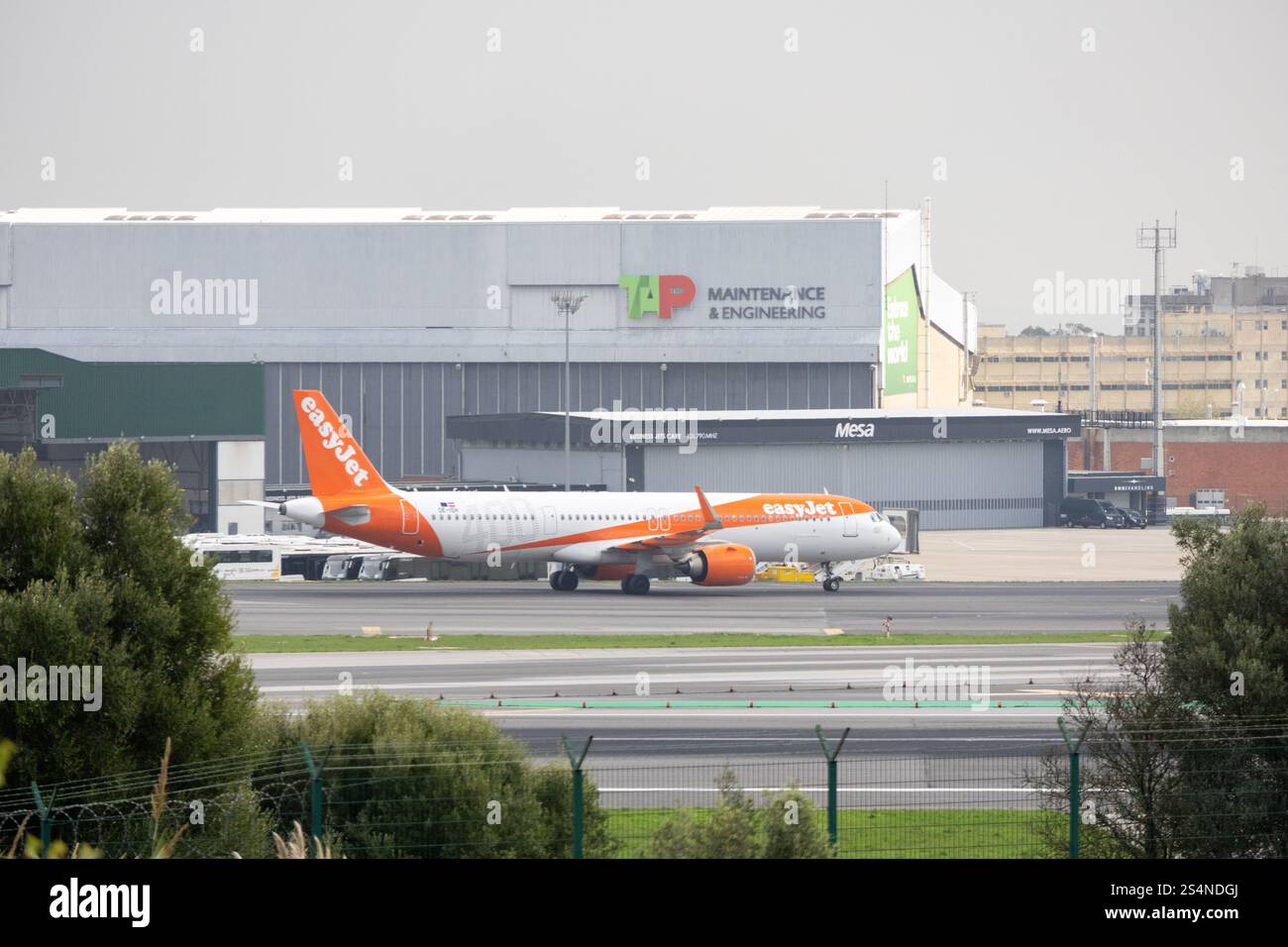 Orange easyjet airbus a320 taxiing at lisbon humberto delgado airport ...