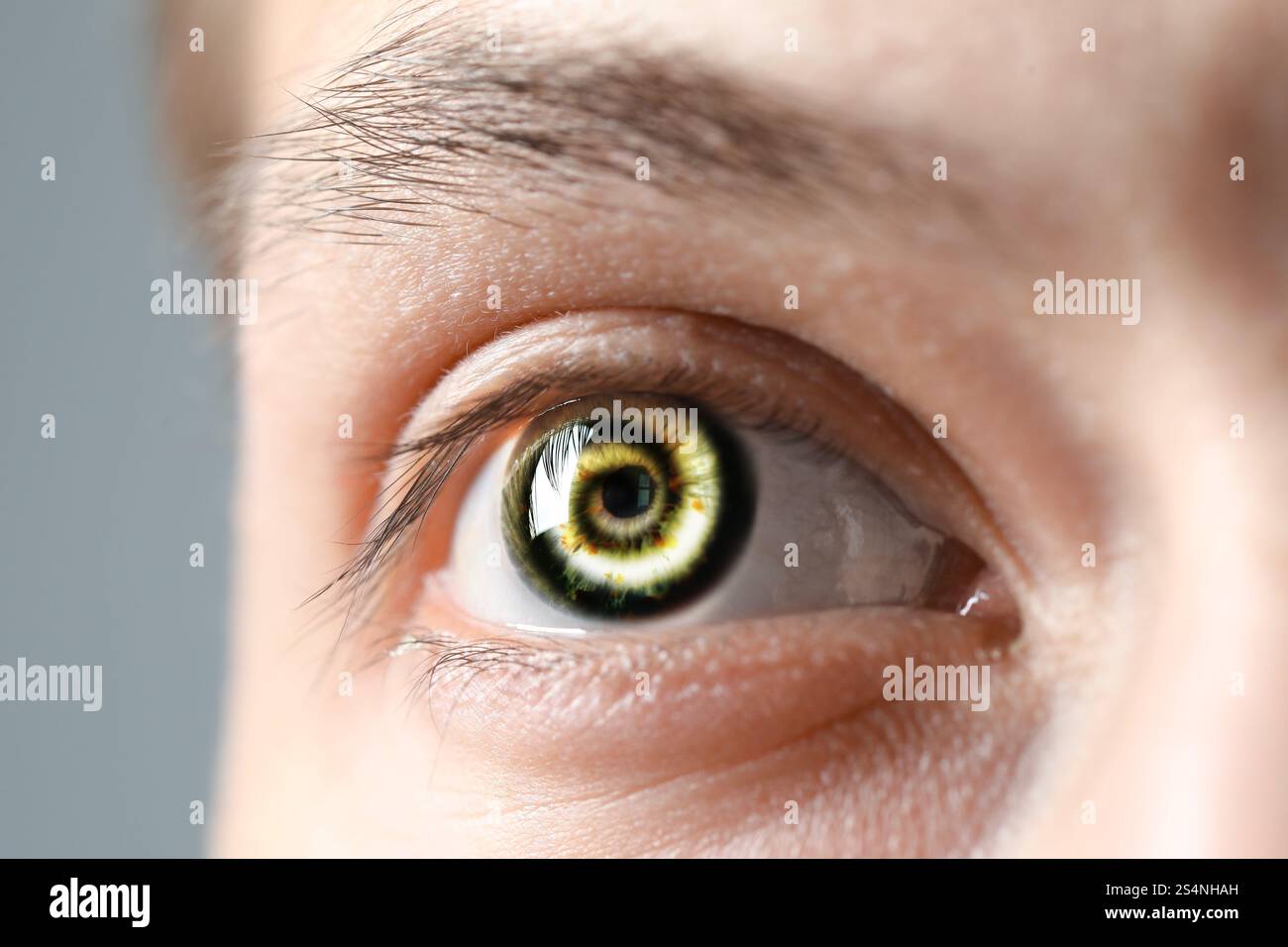 Hypnosis. Spiral symbolizing hypnotic effect in man's eye, closeup ...