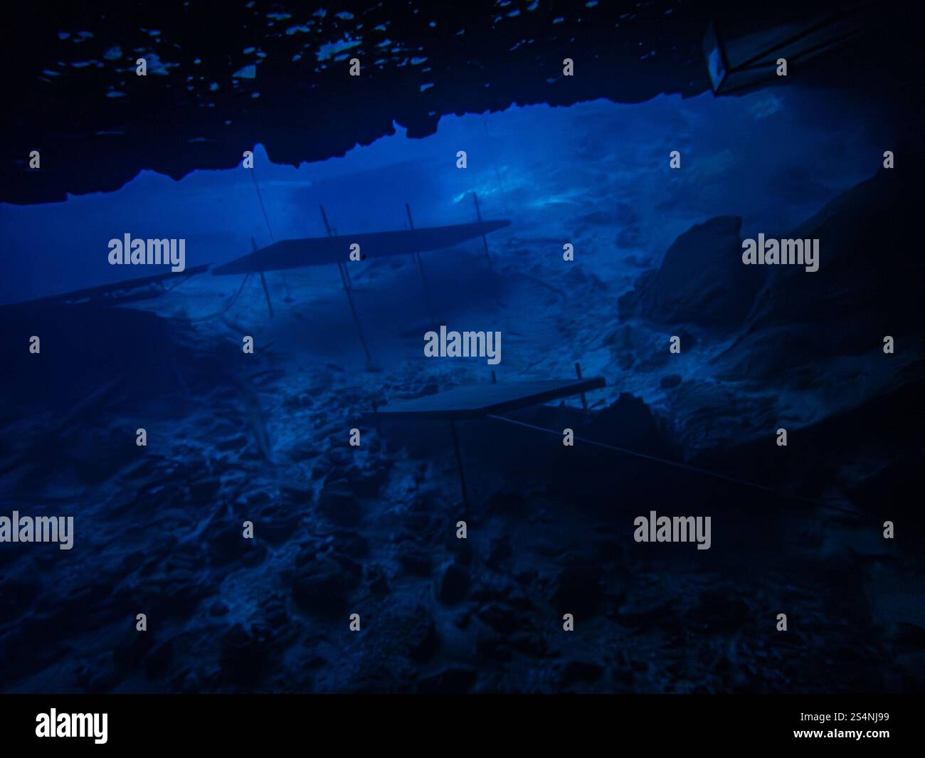 Sunlight illuminating the underwater cavern entrance in the sinkhole at ...