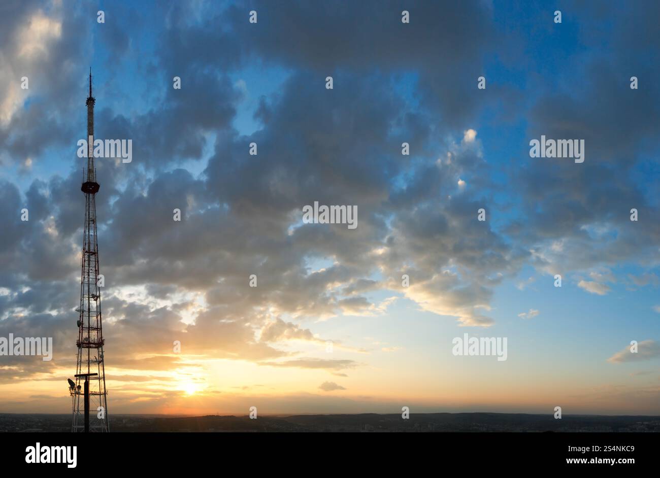 Evening sunset sky with clouds above Lviv City and TV tower view ...