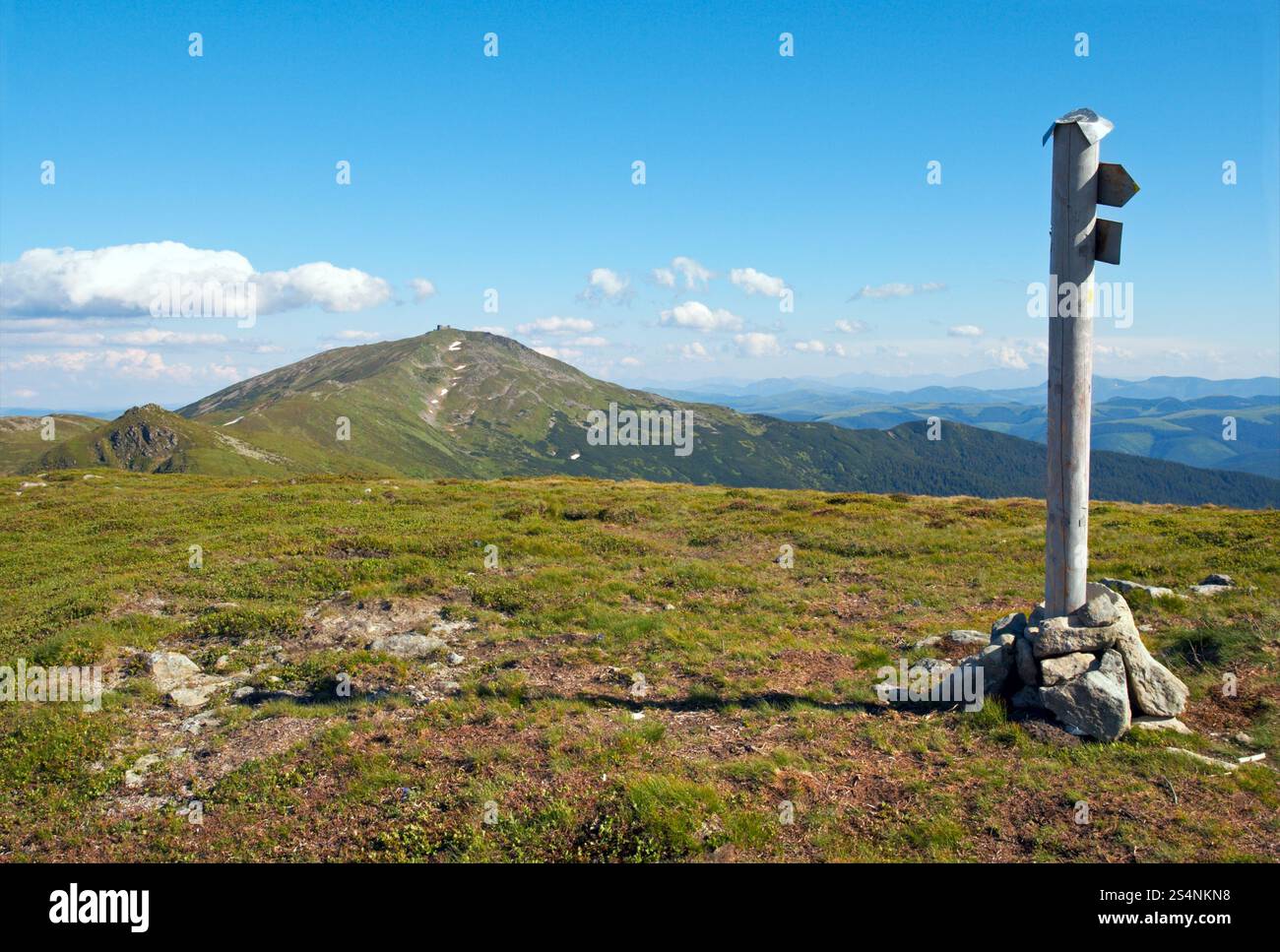 summer mountain landscape with direction sign Stock Photo - Alamy