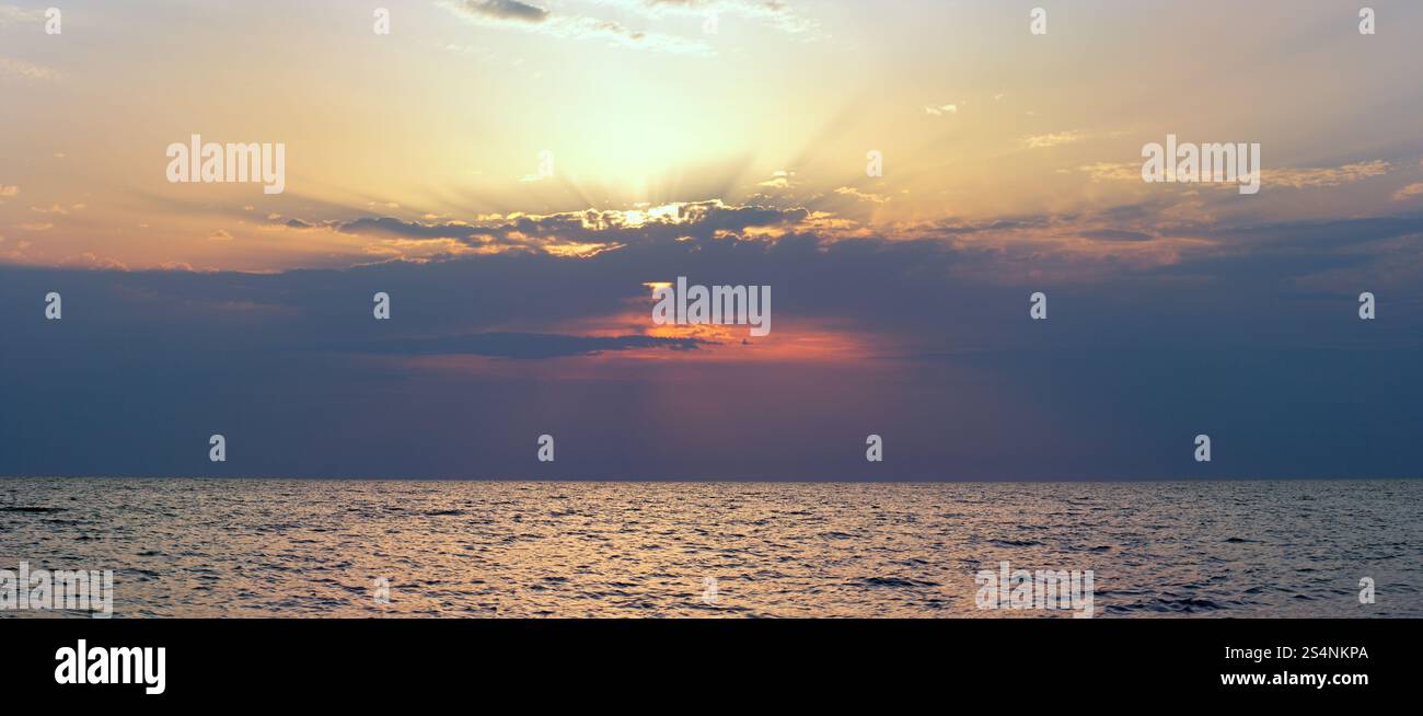 Beautiful sunset over sea surface. Four shots composite picture Stock ...