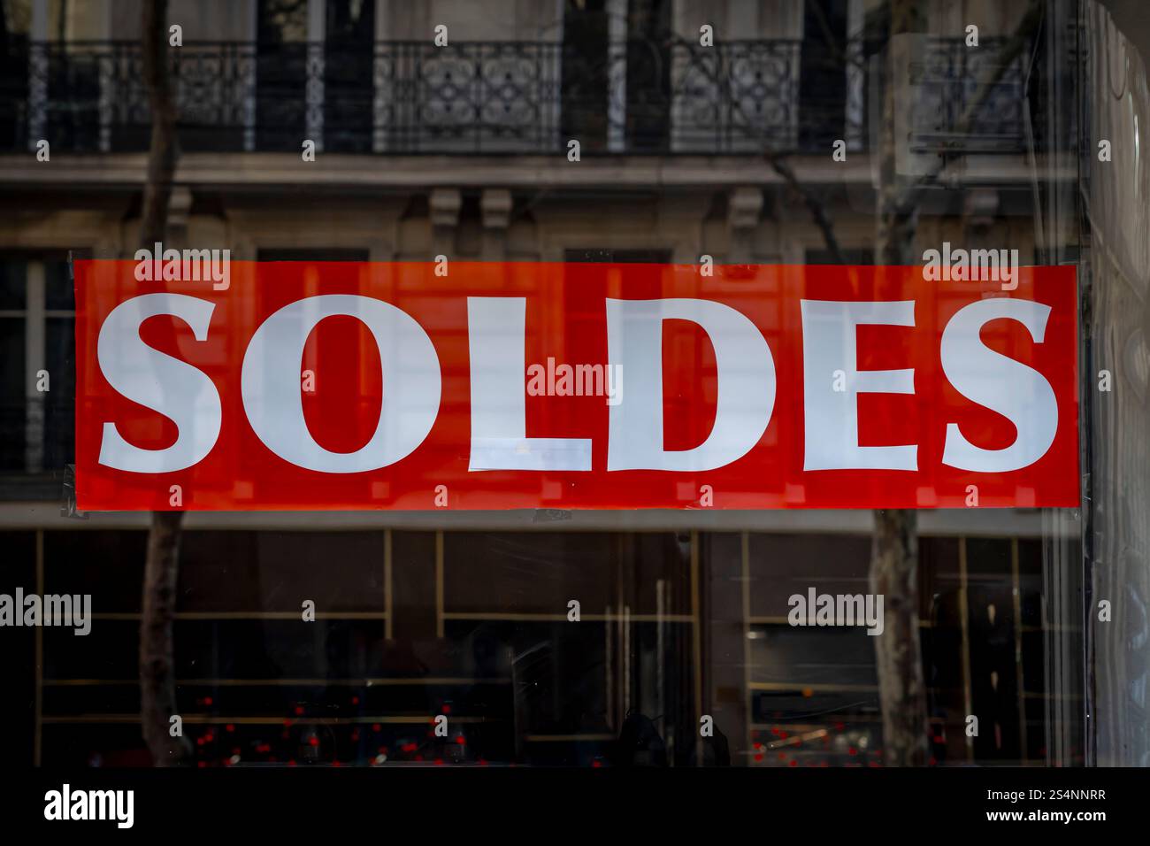 Paris, France - 01 11 2025: A red and white Sale sign in a shoe store ...
