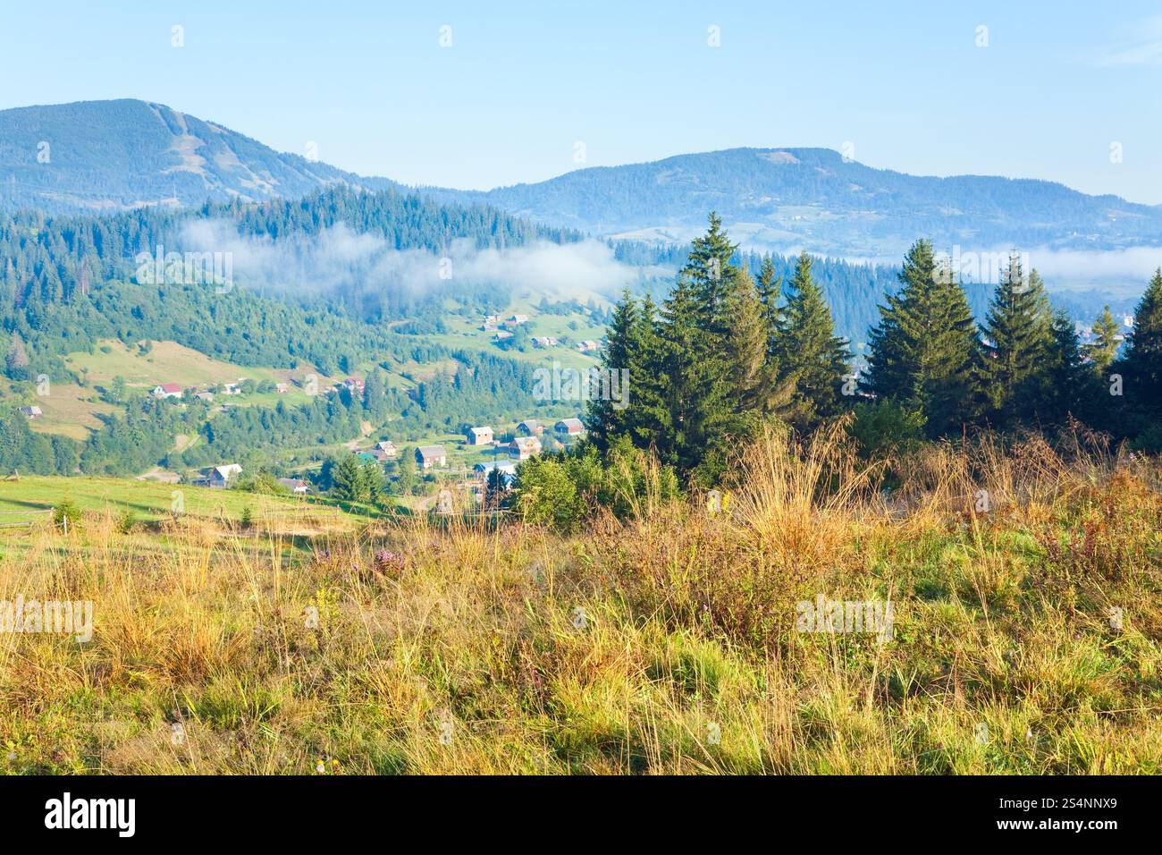Autumn countryside landscape with village on mountainside Stock Photo ...