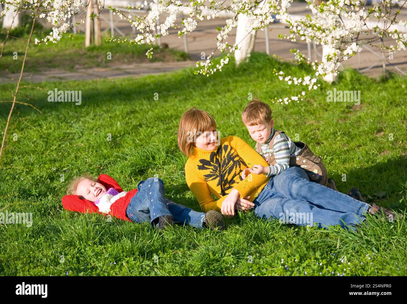Happy mother with small children in spring recreation ground Stock ...