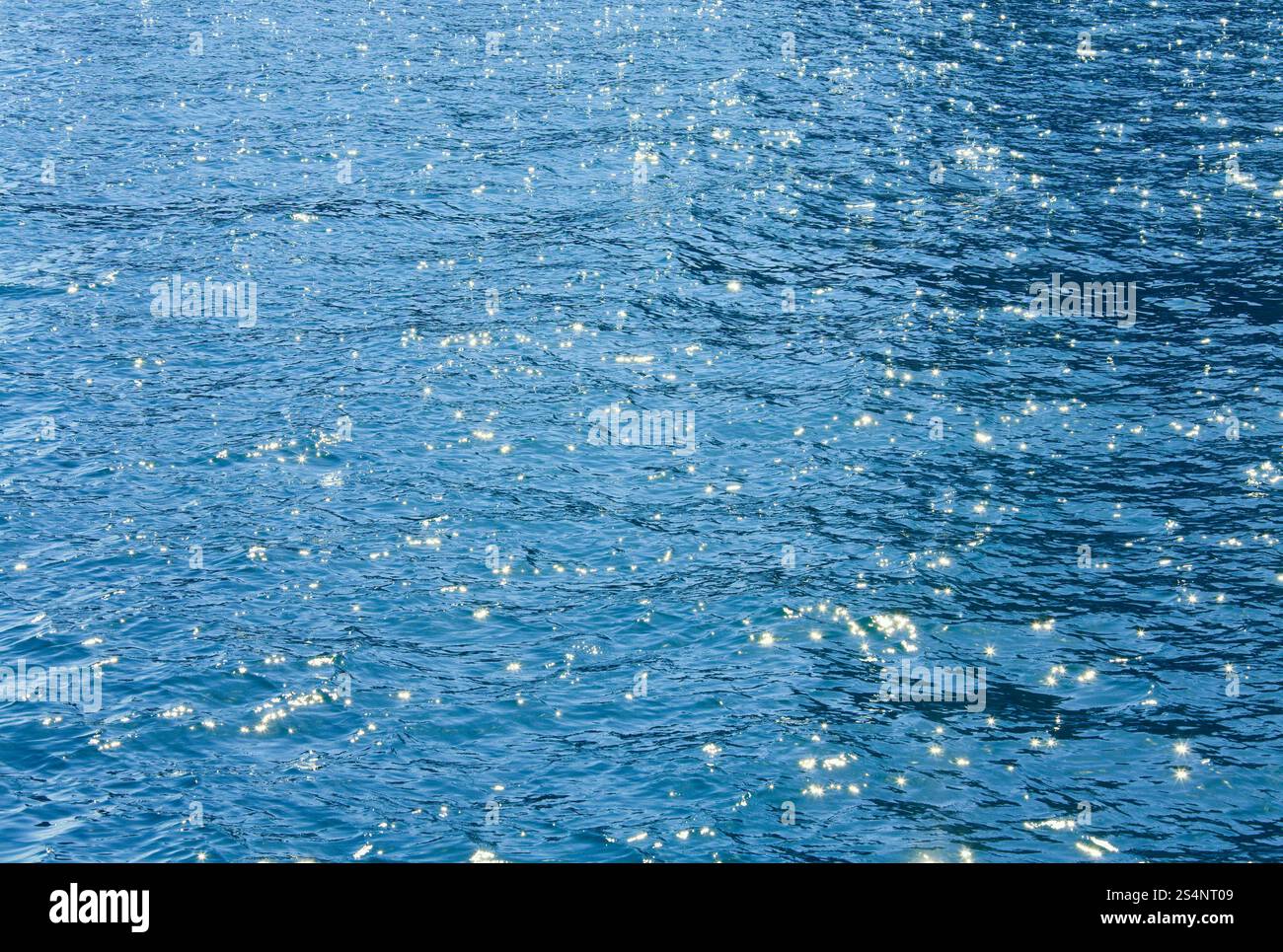 Azure sea water surface with ripple and sun reflections Stock Photo - Alamy