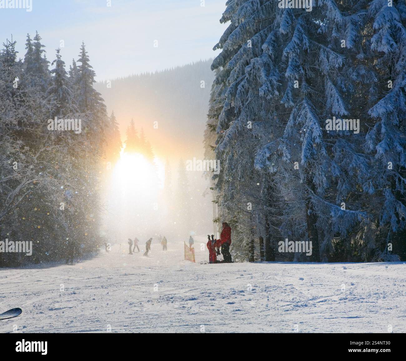 Snow dust dazzle shining on sunlight (winter mountain landscape with ...