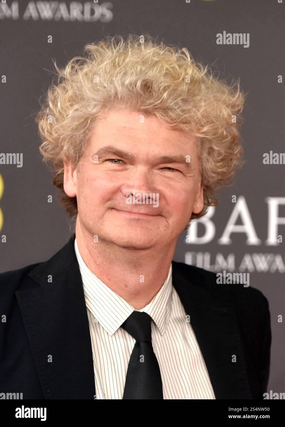 Simon Farnaby attends the 2024 EE BAFTA Film Awards at the Royal ...