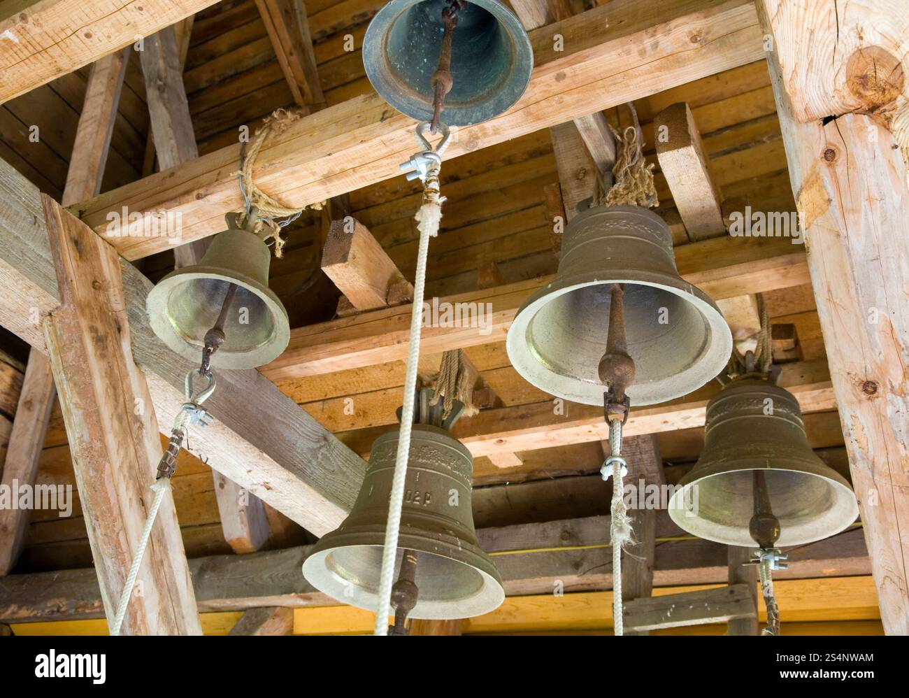 Church bells under the roof of christian monastery Stock Photo - Alamy