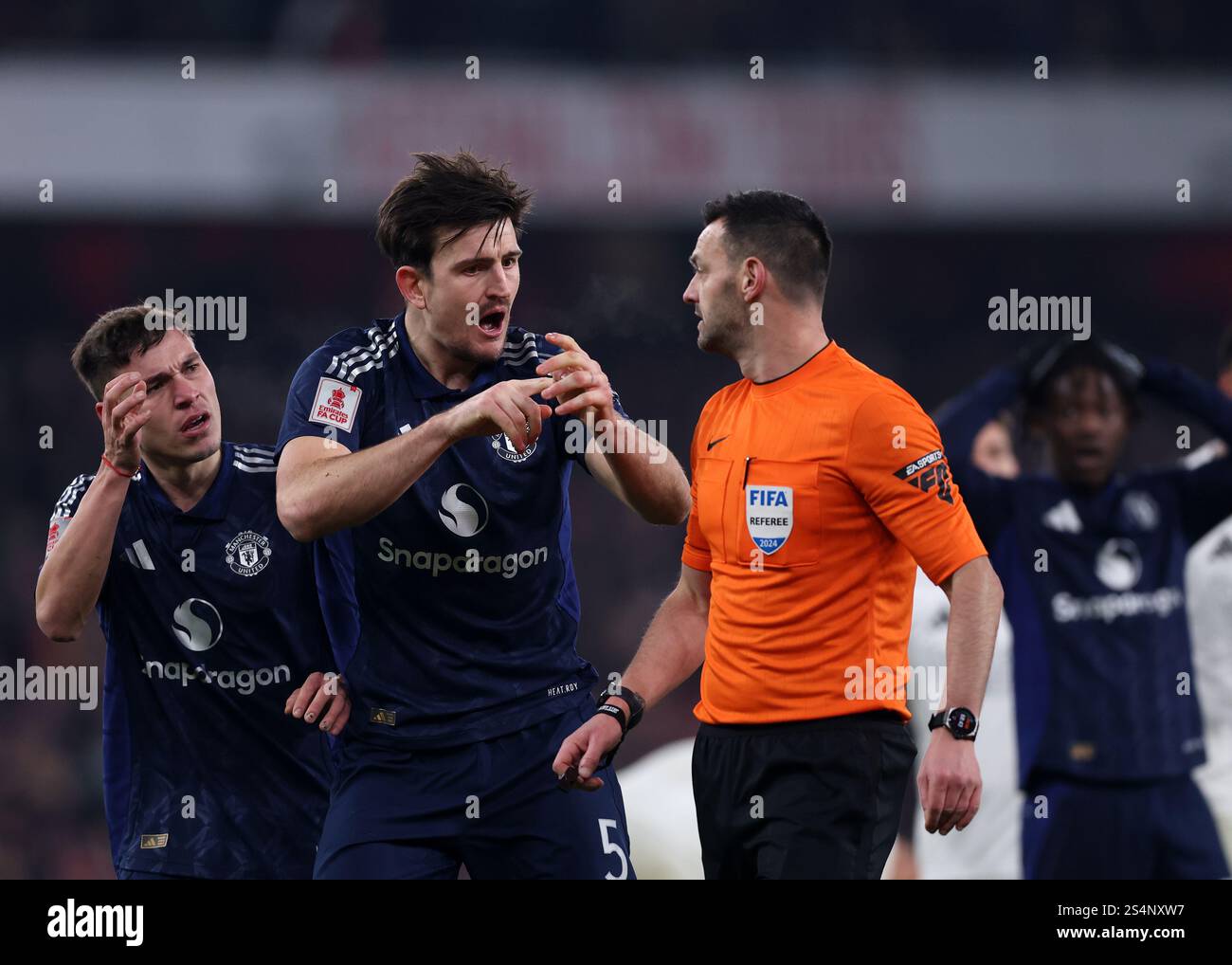 London, UK. 12th Jan, 2025. Manchester United's Harry Maguire argues ...