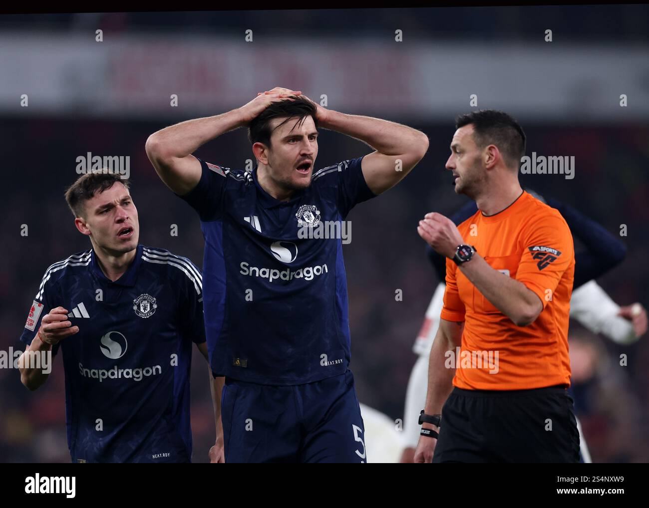 London, UK. 12th Jan, 2025. Manchester United's Harry Maguire argues ...