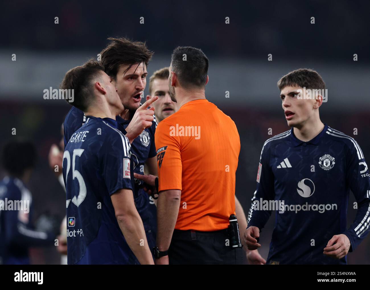 London, UK. 12th Jan, 2025. Manchester United's Harry Maguire argues ...