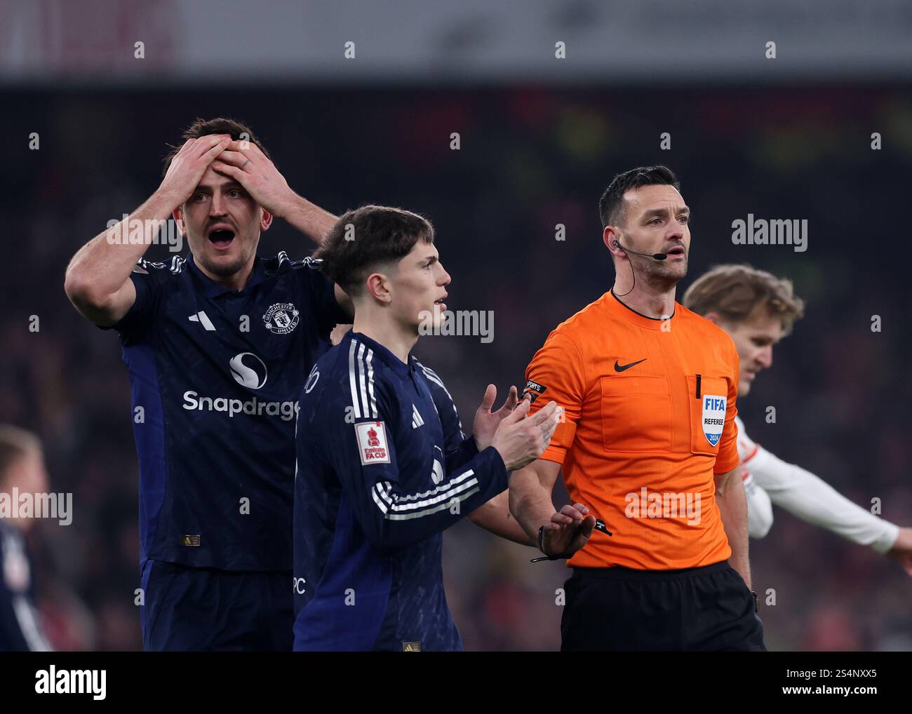 London, UK. 12th Jan, 2025. Manchester United's Harry Maguire argues ...