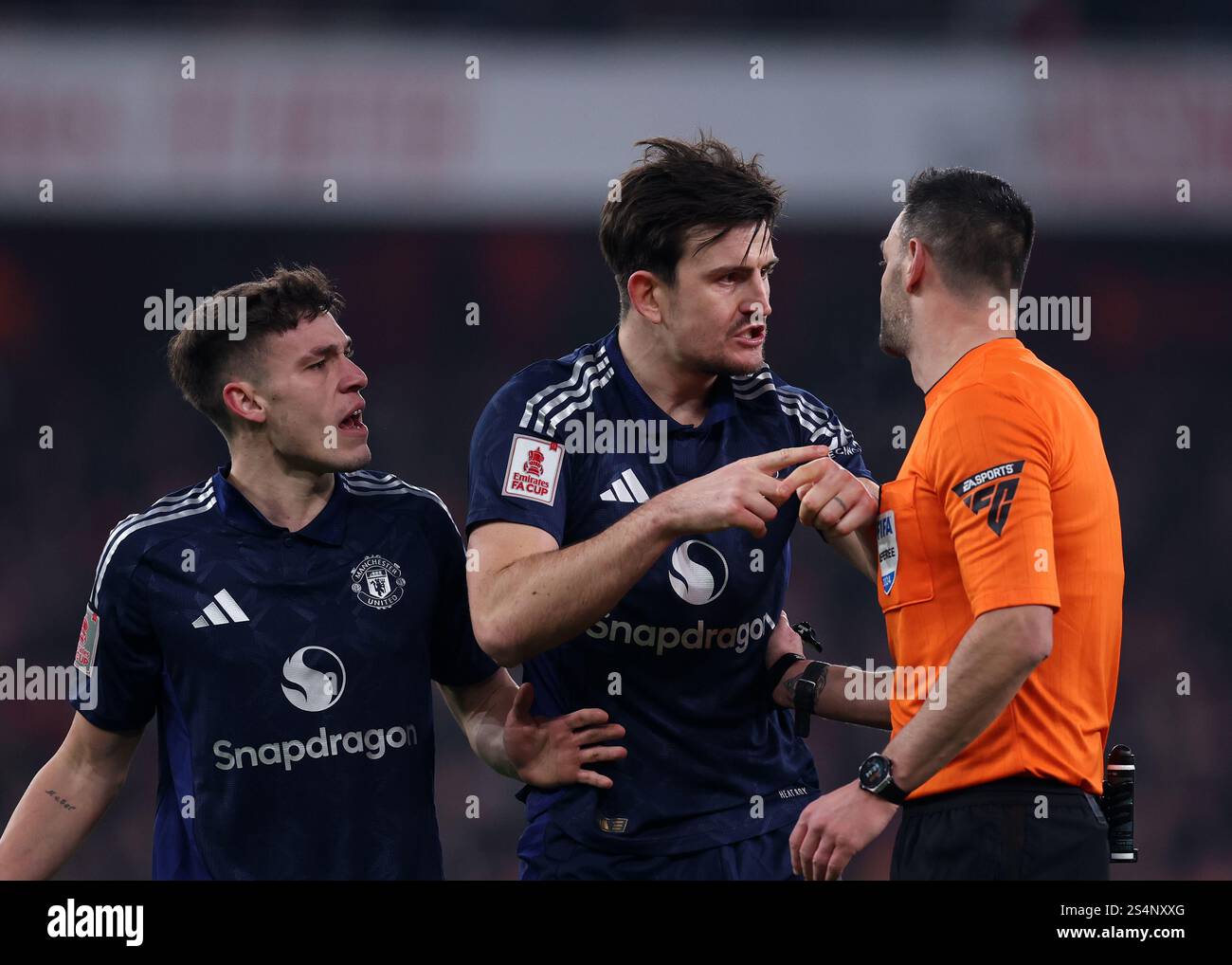 London, UK. 12th Jan, 2025. Manchester United's Harry Maguire argues ...
