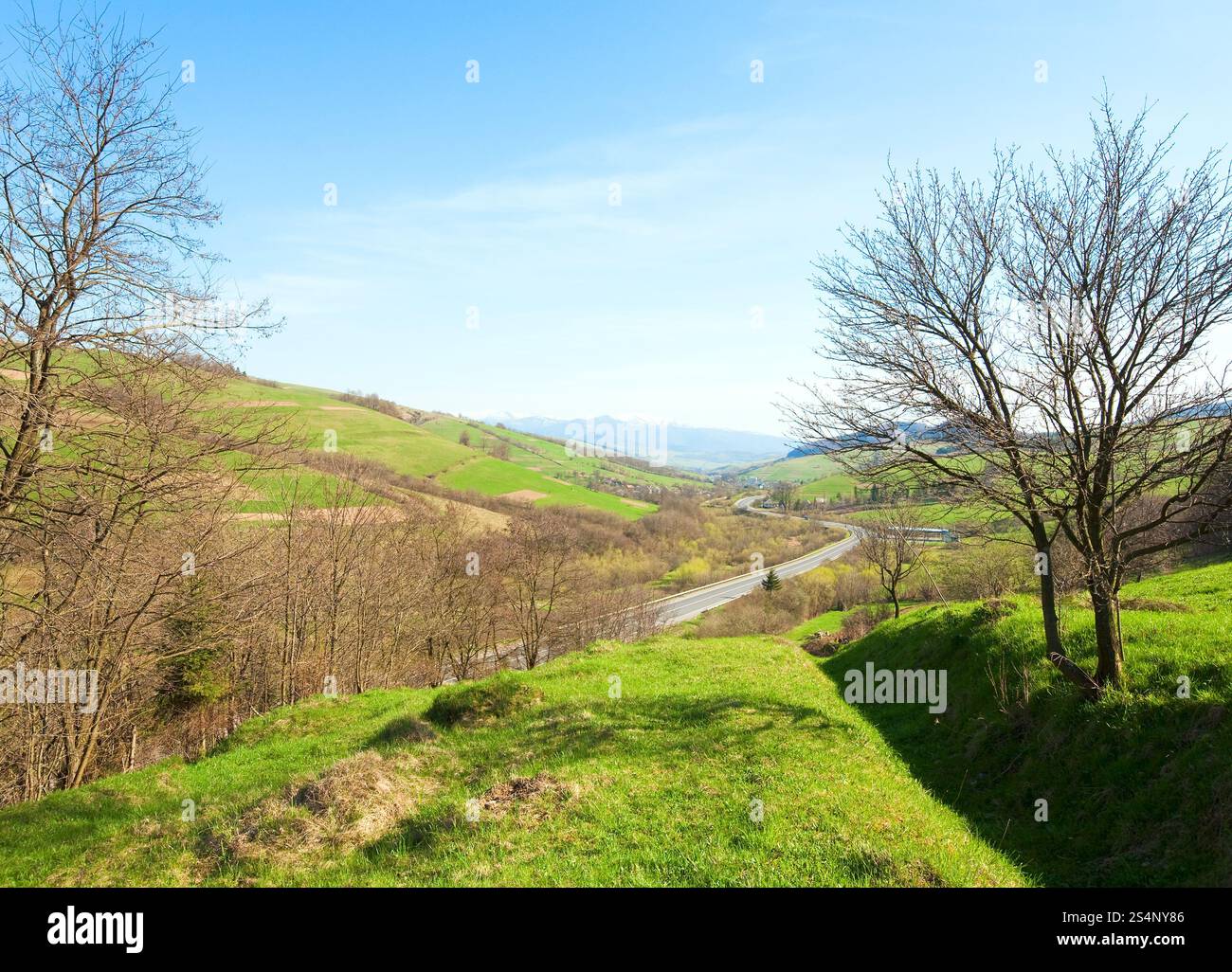 Spring mountain country valley view with farm fields and road Stock ...