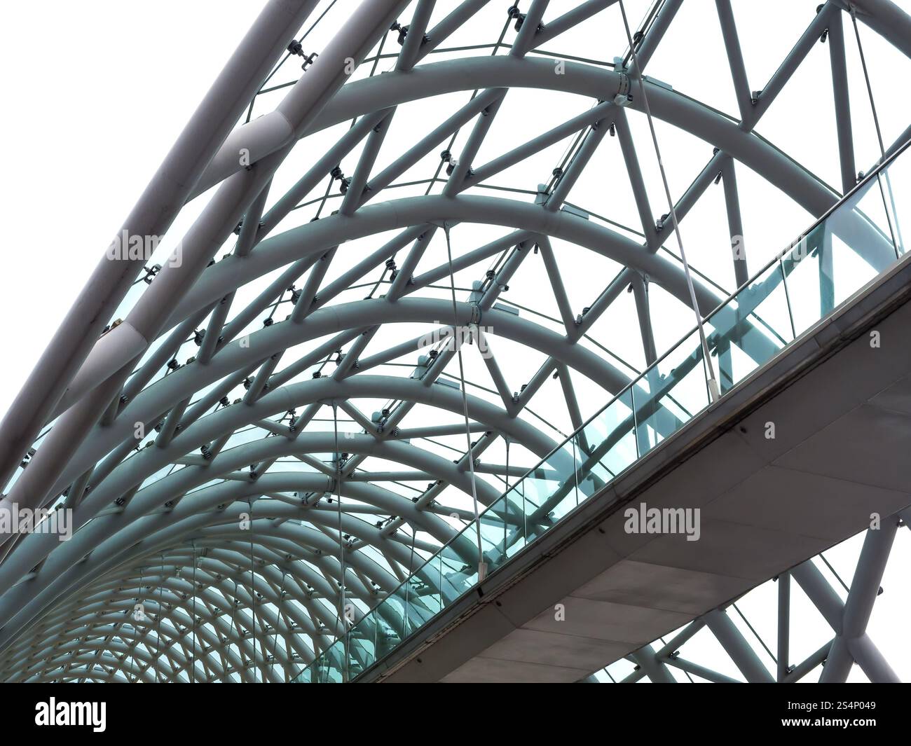 Scene of modern construction of arch ceiling over the glass pathway ...