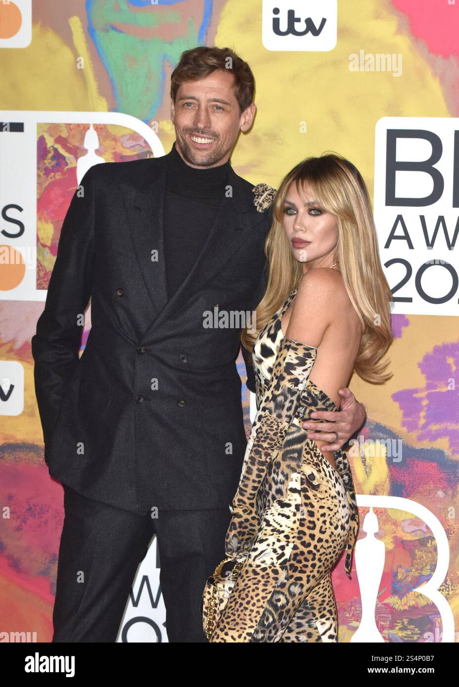 ***EDITORIAL USE ONLY*** Peter Crouch and Abbey Clancy attends The BRIT ...