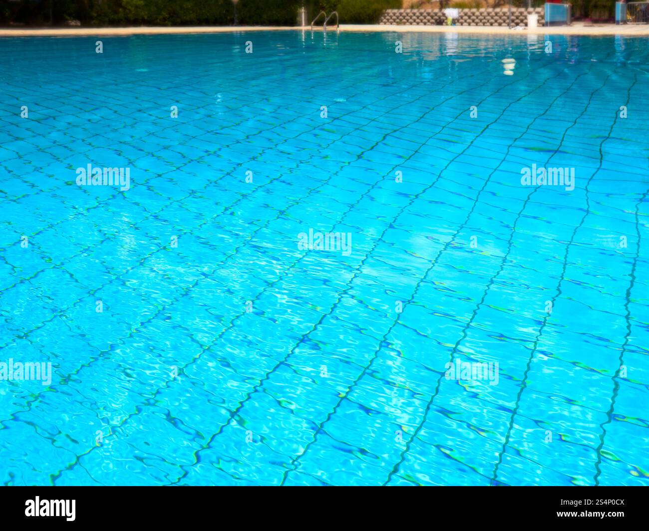 Patterns of sunlight rippling on a swimming pool water surface Stock ...