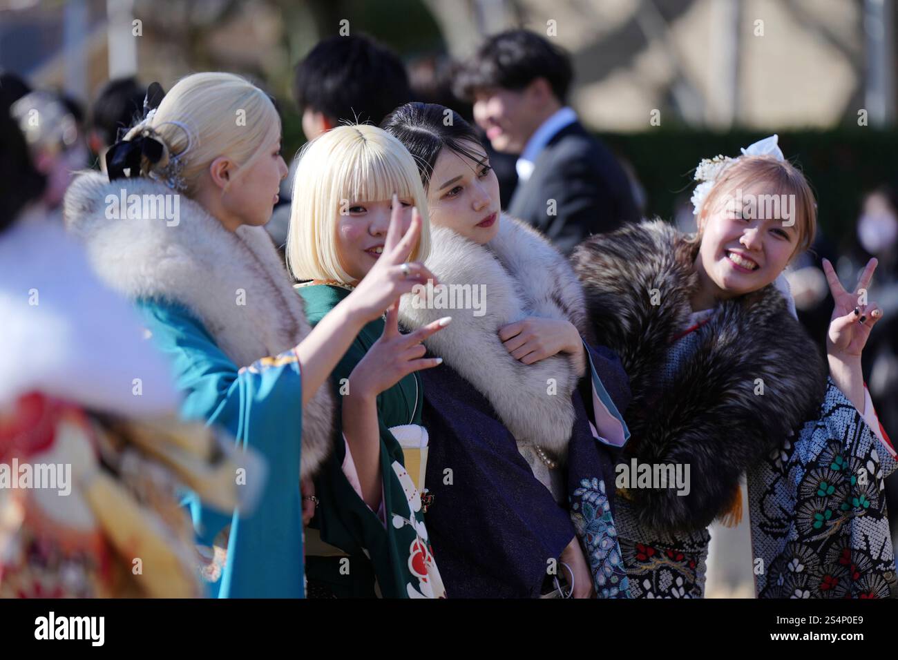 Female participants clad in long-sleeved kimonos, "furisode," at twenty ...