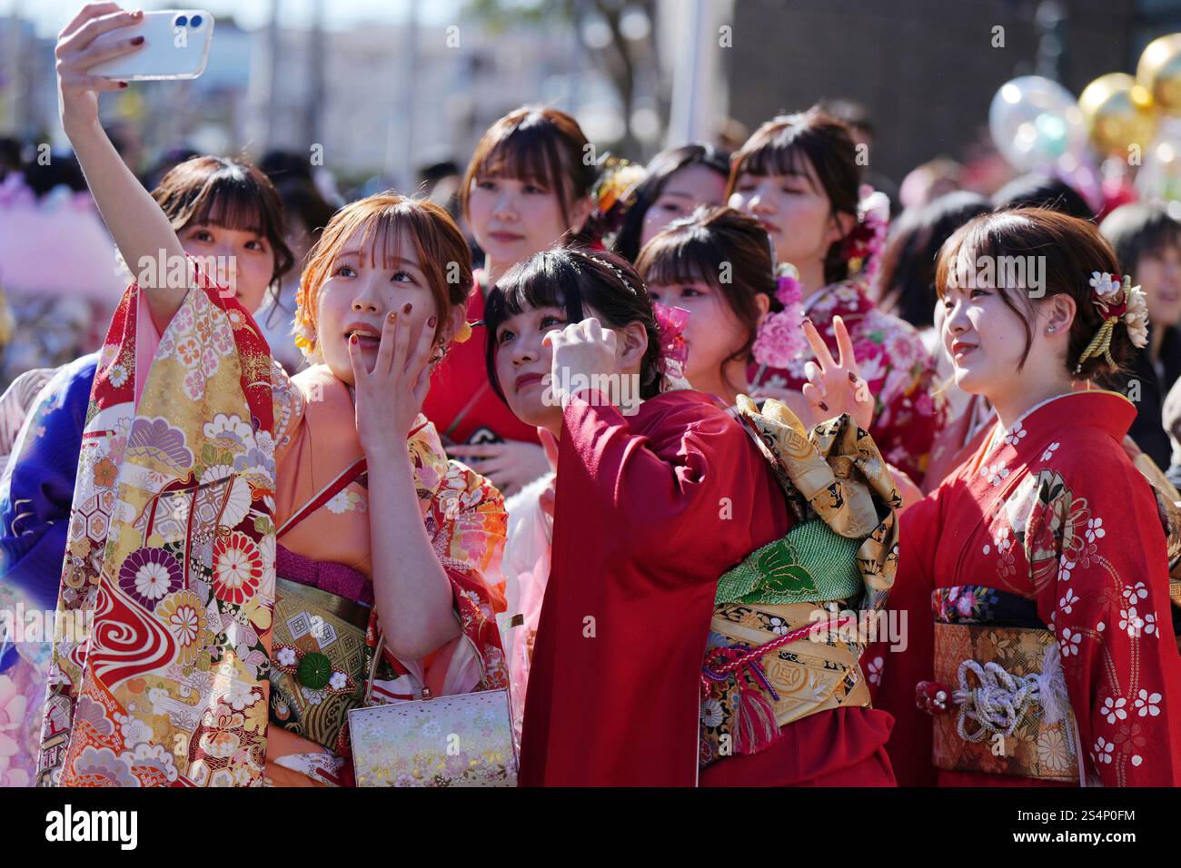 Female participants clad in long-sleeved kimonos, "furisode," at twenty ...