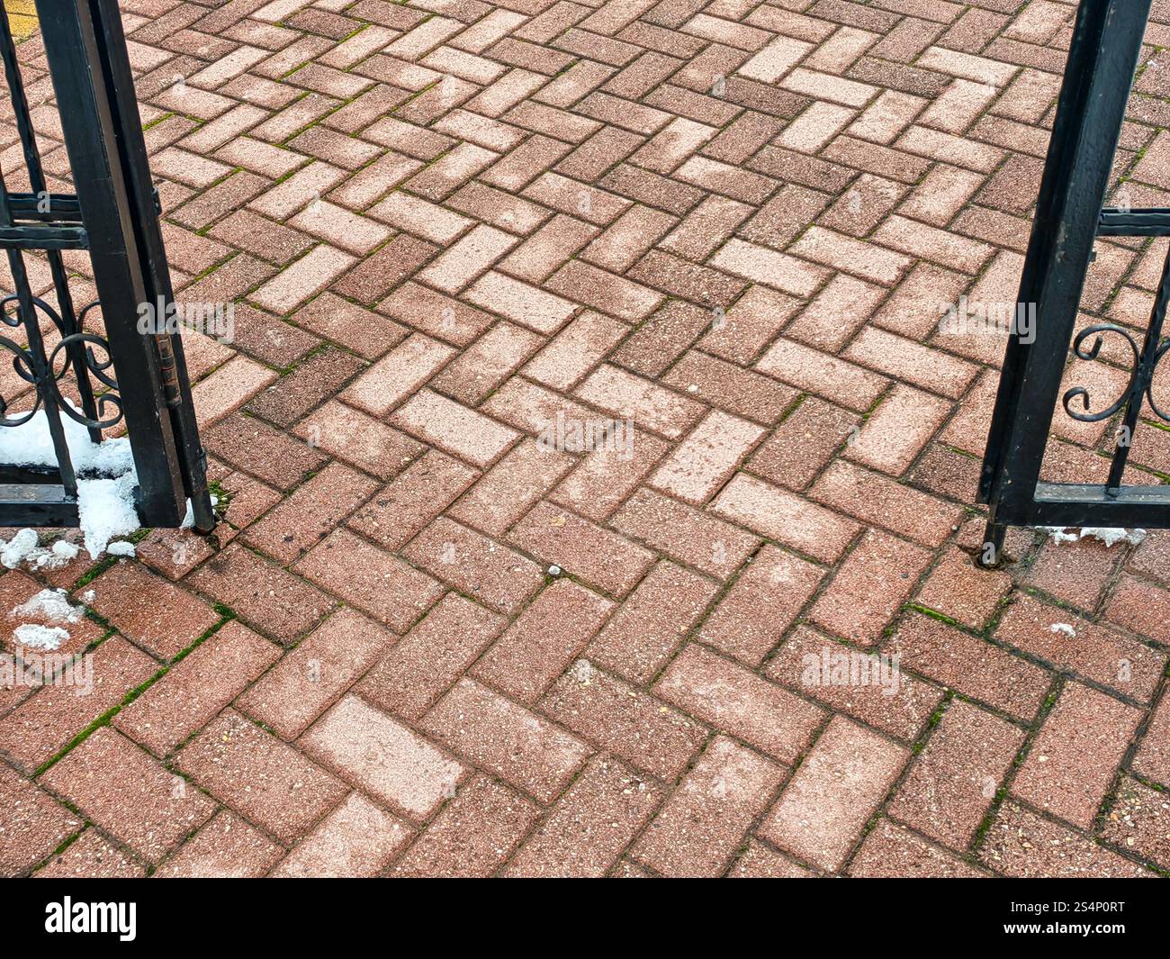 Winter Pathway: Pavement and Metal Door Frame Stock Photo - Alamy